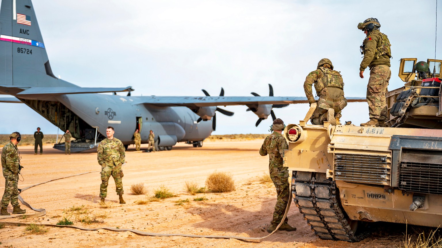C-130 Simulates Refueling M1 Abrams Tank During Exercise