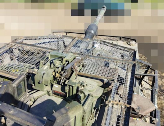 Ukrainian M1 Abrams Tanks Get Elaborate 'Cope Cages,' Soviet Explosive Reactive Armor