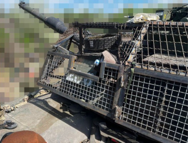 Ukrainian M1 Abrams Tanks Get Elaborate 'Cope Cages,' Soviet Explosive Reactive Armor