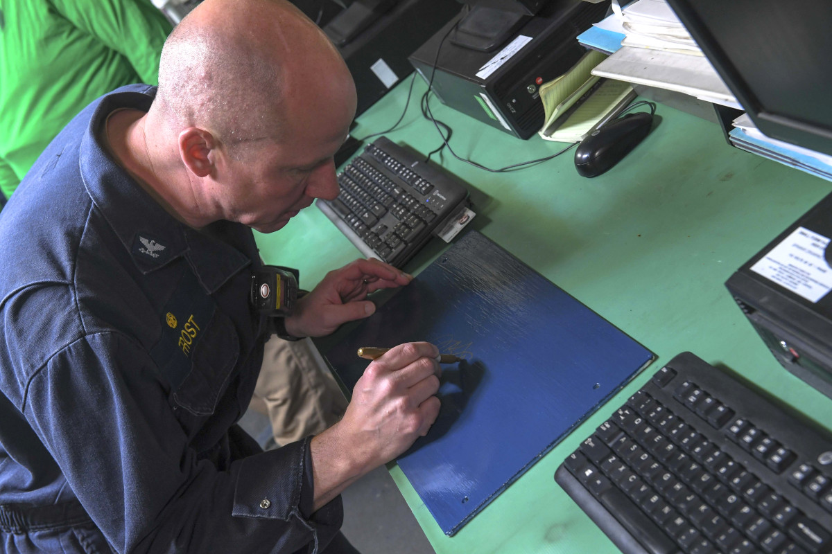 USS America Keeps Captain America Theme Going With Custom Painted Tractor