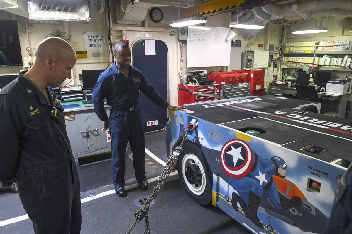 USS America Keeps Captain America Theme Going With Custom Painted Tractor